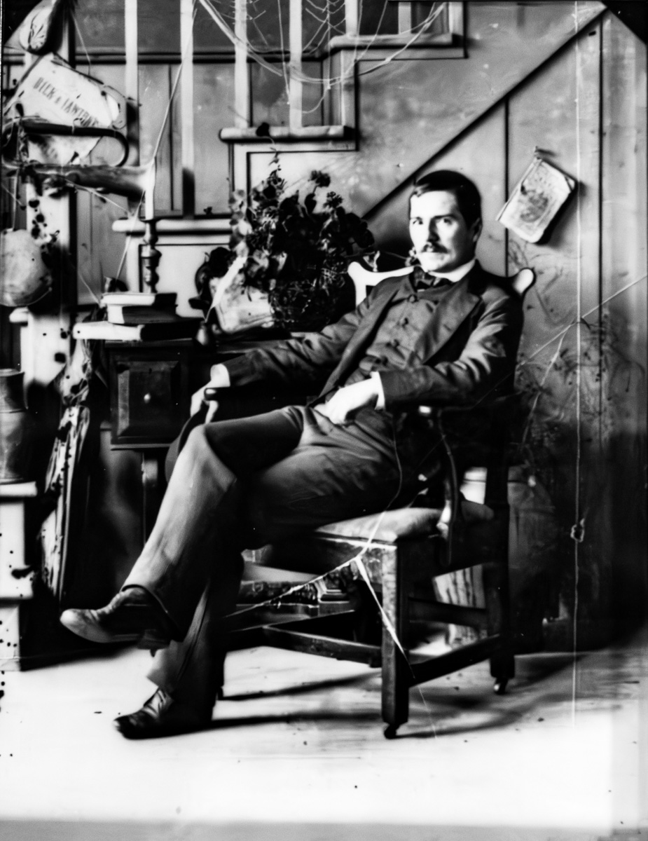 Self-portrait of John F. Peto posed near the staircase in his studio ...