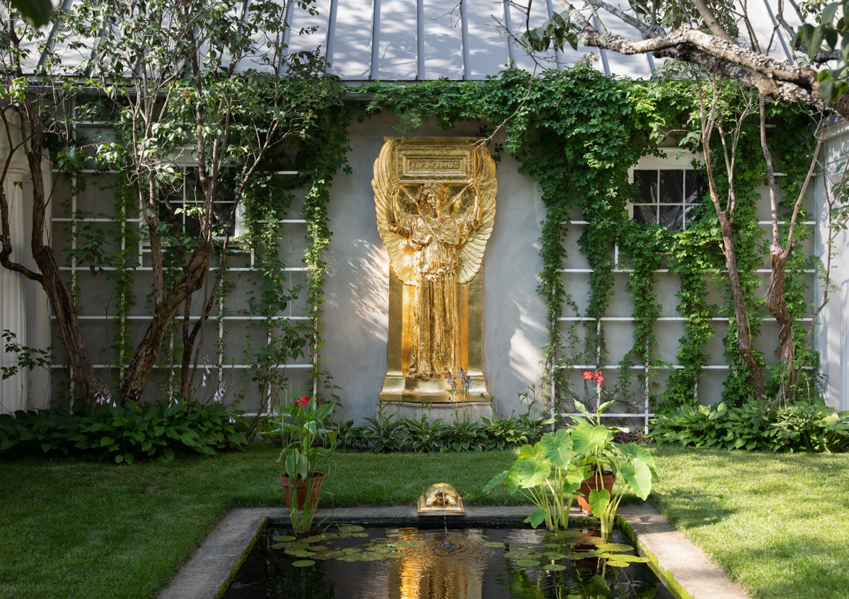 Gilded sculpture by Augustus Saint-Gaudens with reflecting pool ...