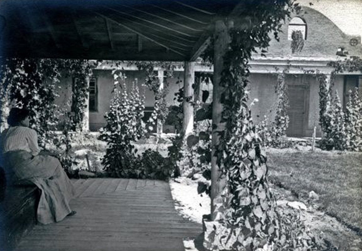 Virginia Walker Couse contemplates her garden c. 1914 from the portal ...